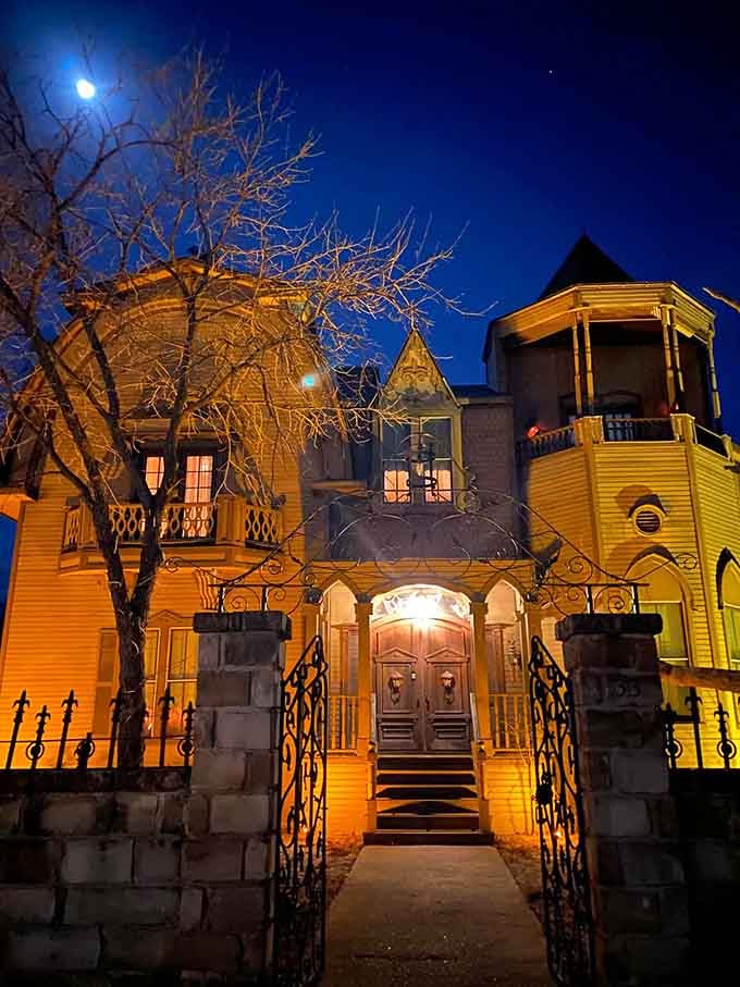 Evening illumination transforms the spooky residence into a glowing tribute to classic TV's most beloved monster family.