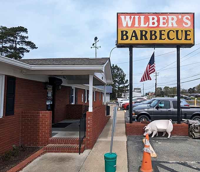 When your pig mascot waves from the sign, you know someone understands barbecue should be fun.