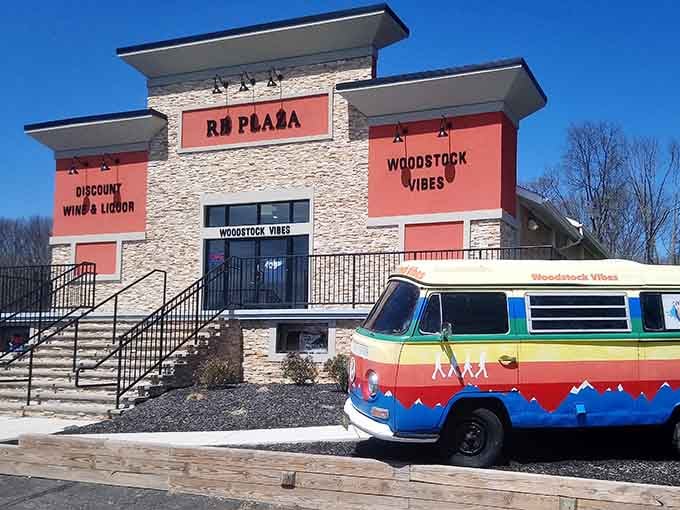 Modern stone facade and bright orange panels create a retro-chic vibe that would make any flower child smile.