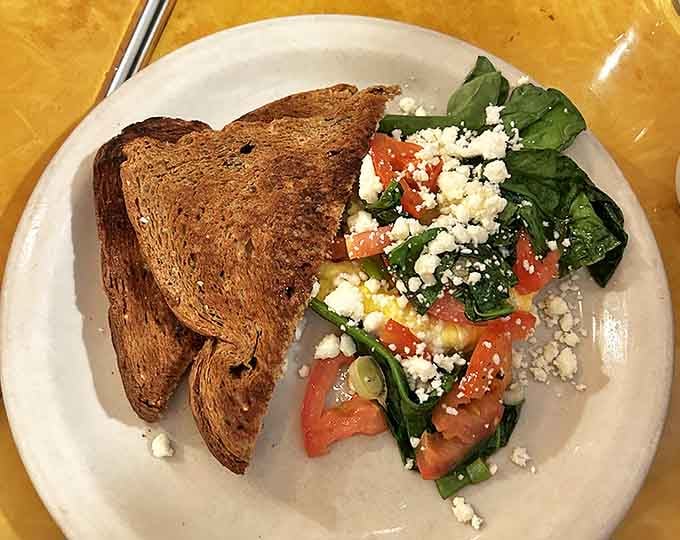 Fresh greens and feta proving that even breakfast joints know how to keep things interesting beyond the griddle.