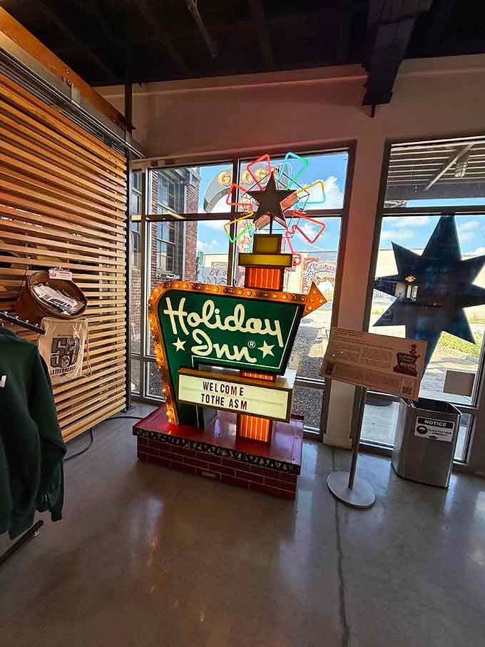 The Holiday Inn sign welcomes visitors with mid-century optimism, when every motel promised comfort and a fresh start.