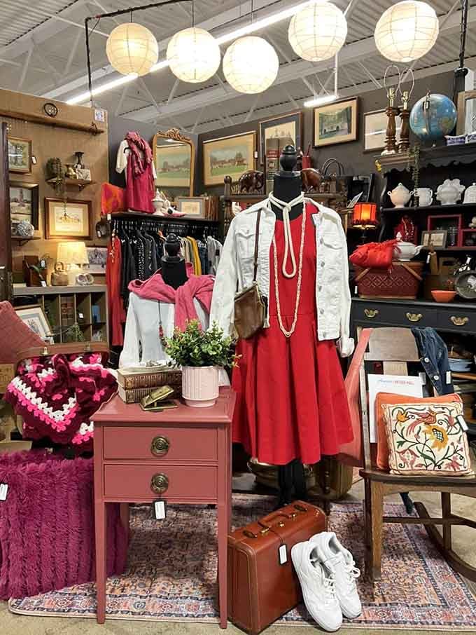 Vintage clothing hangs alongside paper lanterns in a delightful clash of decades and styles.