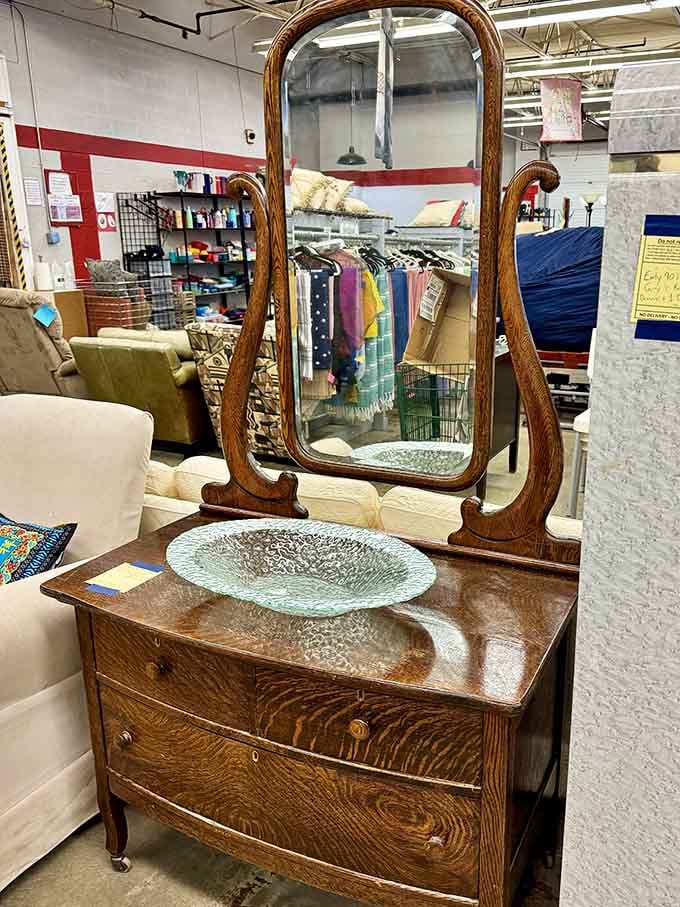 An antique dresser with gorgeous wood grain just waiting for someone to give it a second life at home.