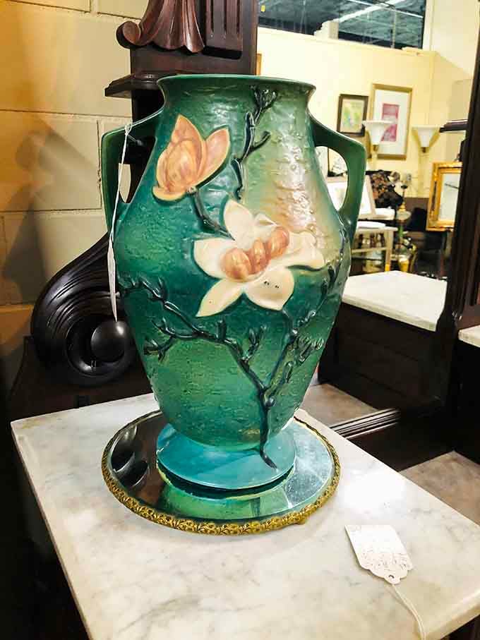 This art pottery vase with magnolia blossoms isn't just decorative – it's Southern elegance captured in clay and glaze.