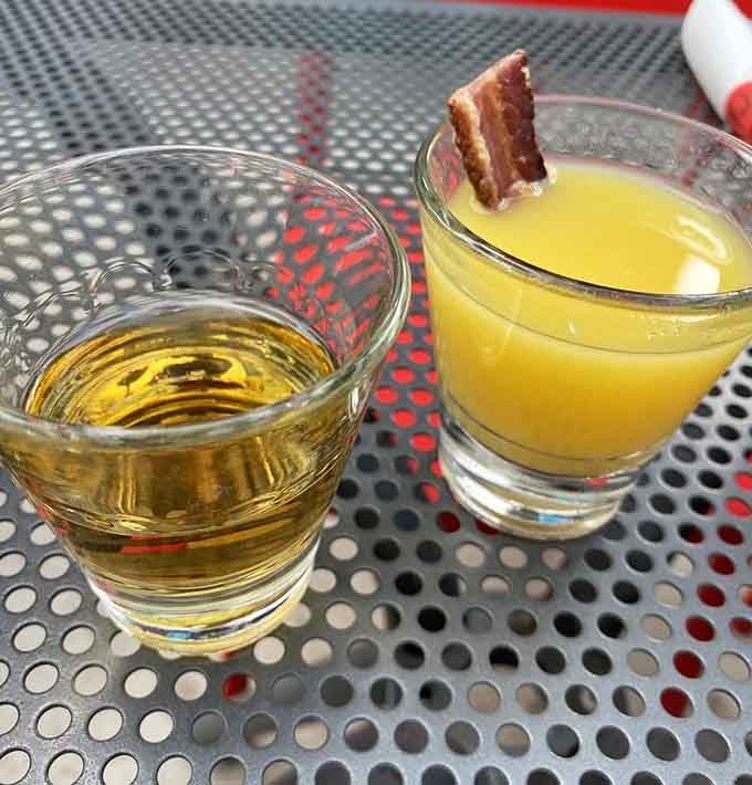 Even the cocktails get bacon garnishes because commitment to a theme is what separates amateurs from legends.