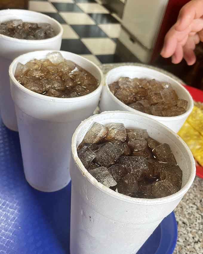 Styrofoam cups filled with ice-cold drinks, because some classics don't need improving or Instagram filters to shine.