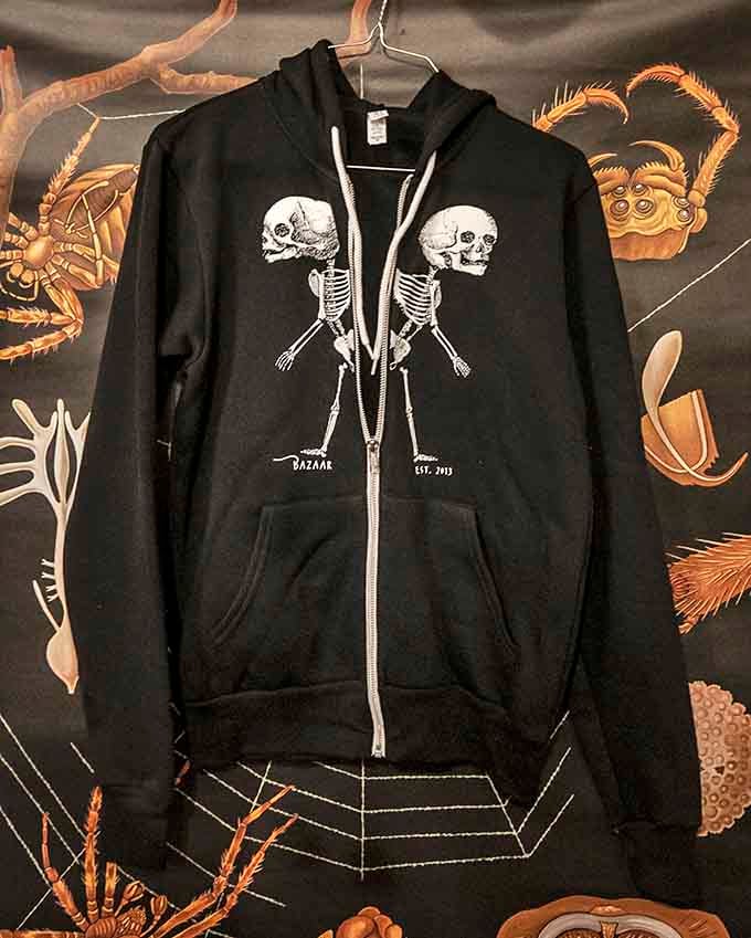Even the merchandise celebrates the shop's quirky spirit with skeleton designs that are oddly charming and perfectly wearable.