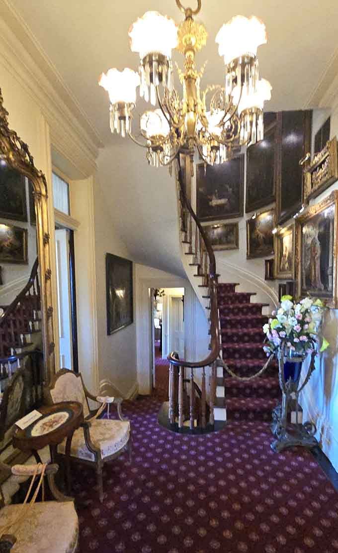 That staircase is basically begging you to make a grand entrance you'll never actually pull off gracefully.
