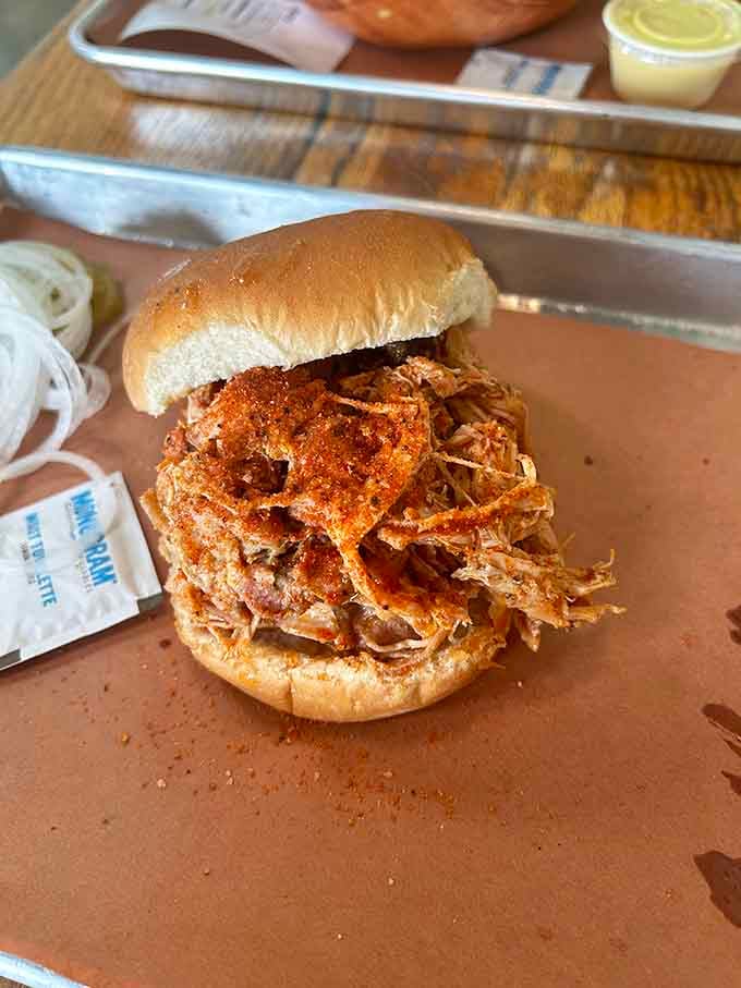 Pulled chicken piled high on a soft bun, ready to make your lunch break infinitely better today.