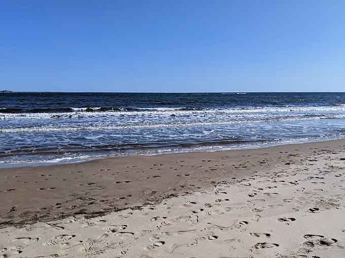 Peaceful shoreline views where calm waters meet endless sky in perfect coastal harmony today.