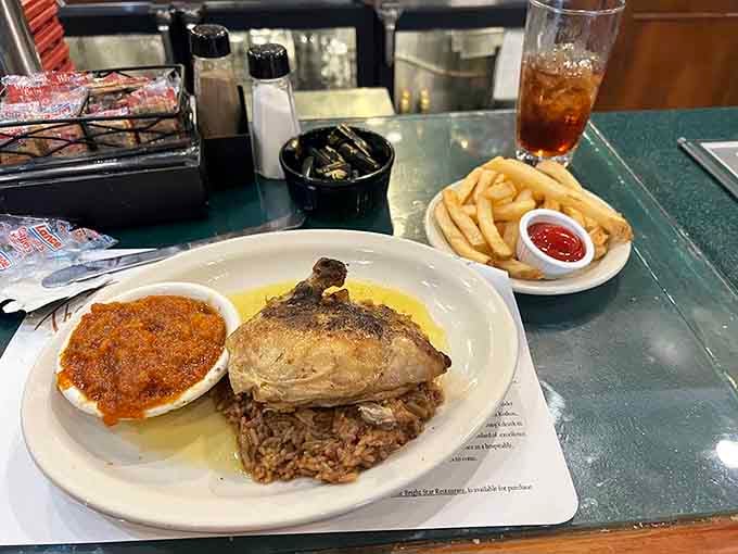 Snapper over dirty rice with a side of greens is why people drive across state lines.