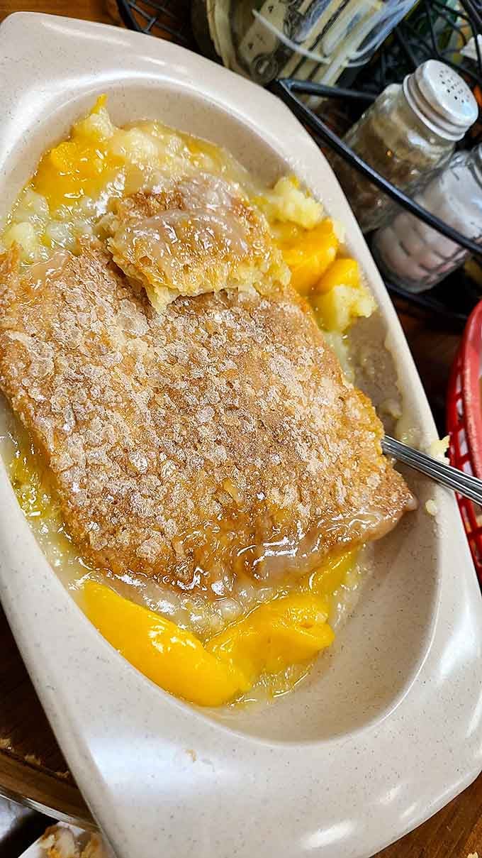 Peach cobbler swimming in buttery goodness, because Georgia knows how to treat its state fruit with respect.
