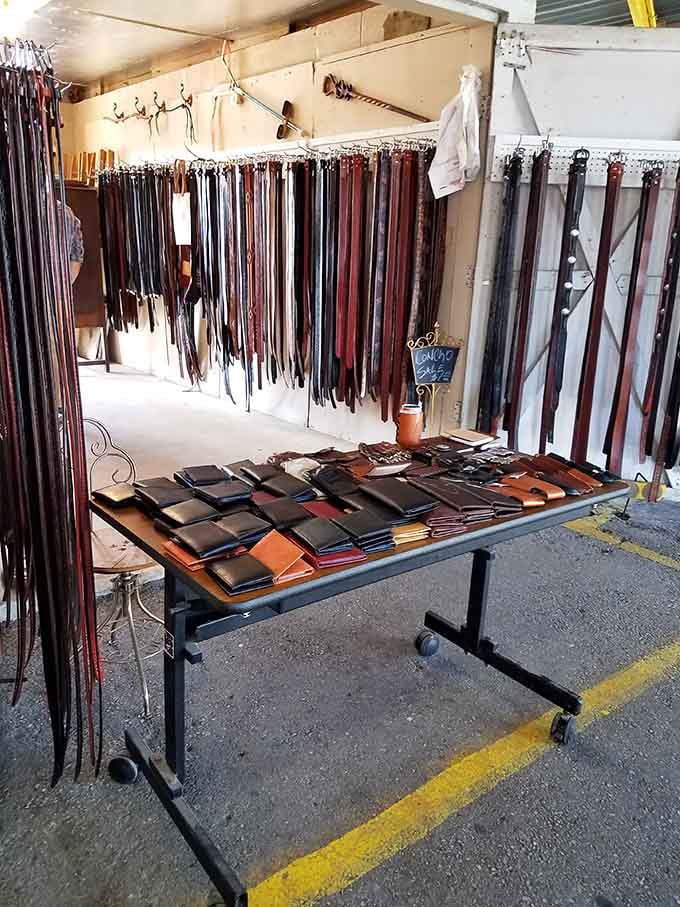 Leather belts hanging like a Western wear waterfall, ready to cinch any outfit with authentic cowboy style.