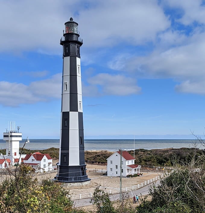 The newer lighthouse stands crisp and clean, still actively guiding ships while its older sibling enjoys a well-earned retirement.