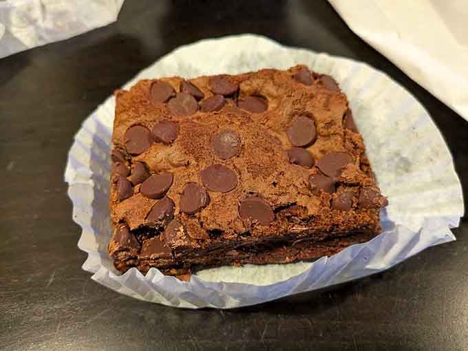 This brownie is so fudgy and chocolate-studded, it should come with a warning label and a glass of milk.
