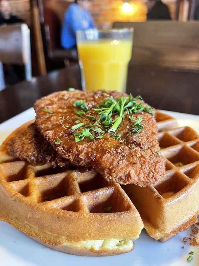 Crispy fried chicken perched atop a golden waffle is the kind of sweet-and-savory harmony that makes life worth living.