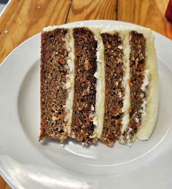 That carrot cake isn't just dessert, it's four layers of sweet justification for any caloric splurge. Worth every delicious forkful of momentary guilt.