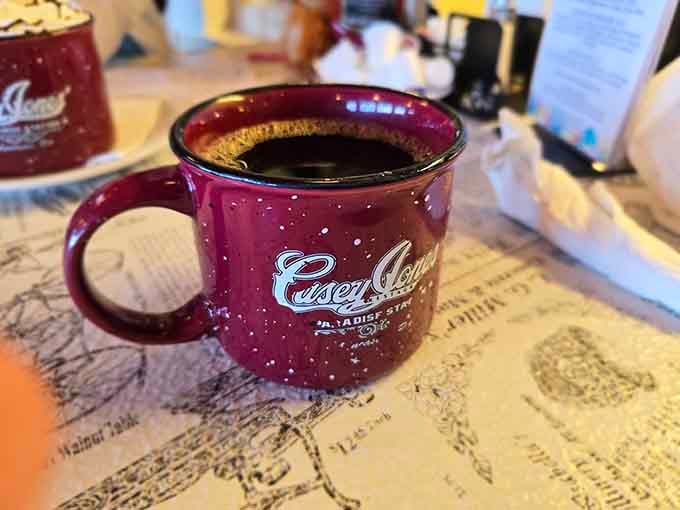 Coffee served in a speckled camp mug because regular cups are too boring for a train restaurant.