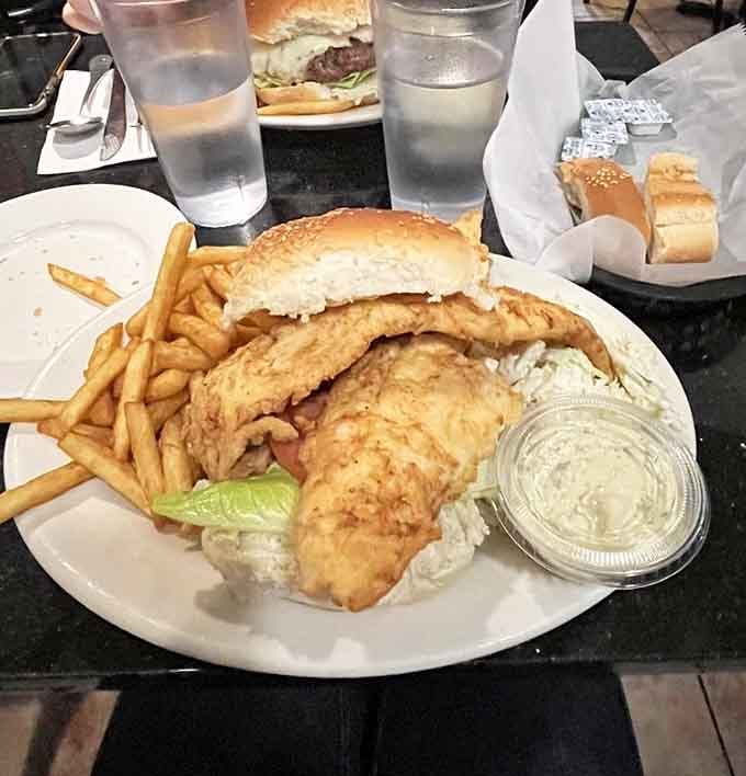The haddock sandwich towers so high it challenges the structural integrity of traditional sandwich architecture entirely.