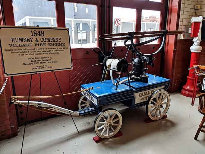 This hand-pumped village fire engine proves that fighting fires started small but the bravery was always full-sized.