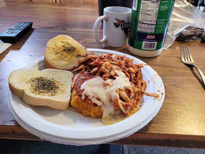 This chicken parm isn't just dinner; it's an Italian-American hug on a plate, complete with garlic toast for sopping up every last bit.