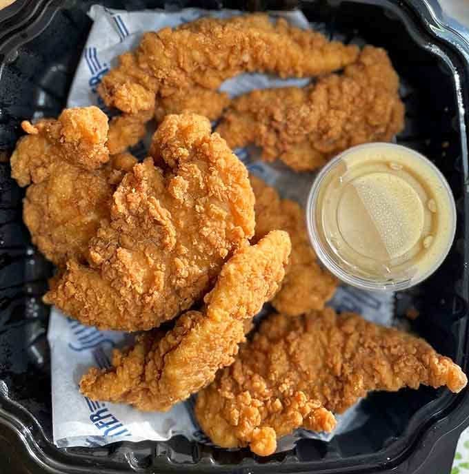 Golden, crispy chicken tenders that prove sometimes the classics don't need improvement, just proper execution and love.