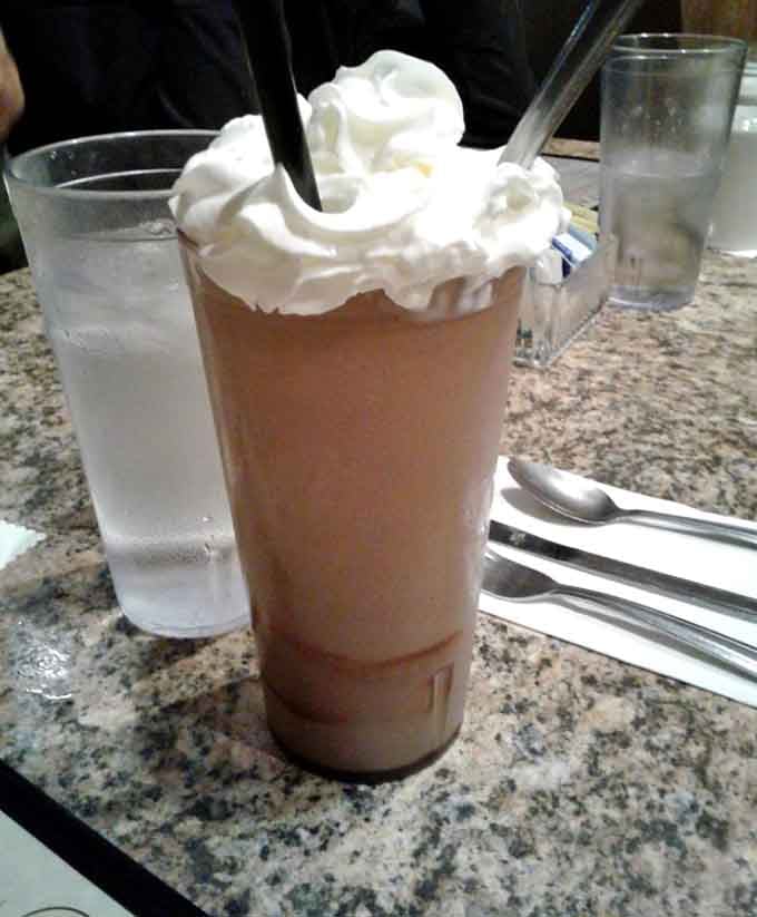 This isn't just a milkshake&mdash;it's a tower of dairy devotion topped with enough whipped cream to make your cardiologist nervously clear their throat.