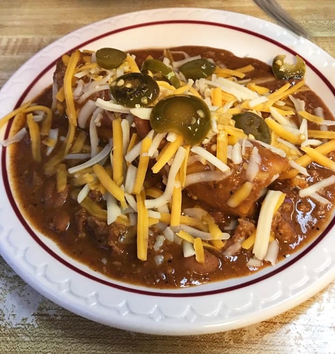 Beef tamales topped with chili, cheese, and jalapeños prove this diner isn't afraid of bold flavors.