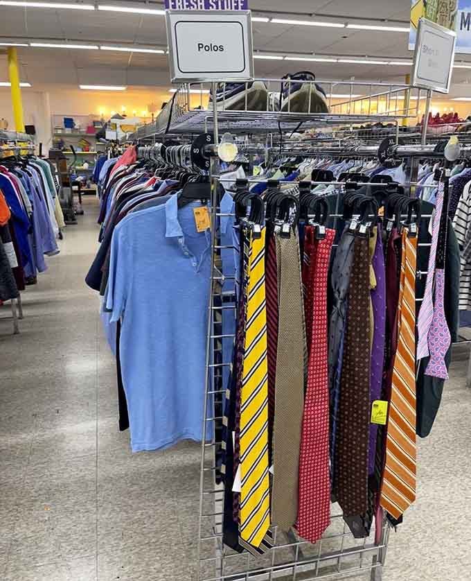 Polos and ties organized like a department store, proving thrift shopping doesn't mean sacrificing style or professional appearance anymore.