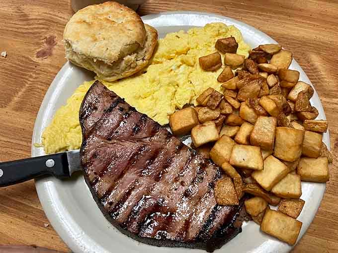 Country fried steak with eggs and potatoes, the kind of plate that makes you understand Southern breakfast devotion.