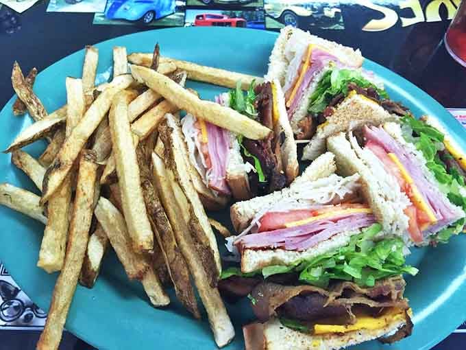 The club sandwich that requires both hands and a strategy session &ndash; layers of deli goodness that puts sad desk lunches to shame.