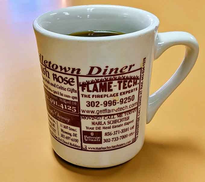 The coffee mug doubles as local advertising&mdash;multitasking at its finest while delivering that essential morning caffeine.