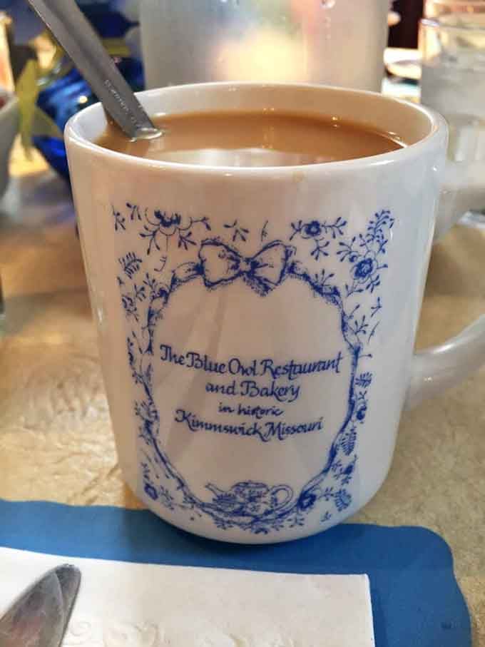 Even the coffee mugs tell a story here, cradling liquid comfort in blue and white porcelain that feels like an heirloom.