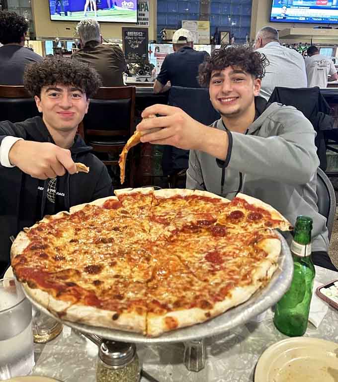 The smiles say it all: this is the kind of pizza that turns a regular meal into a memory.