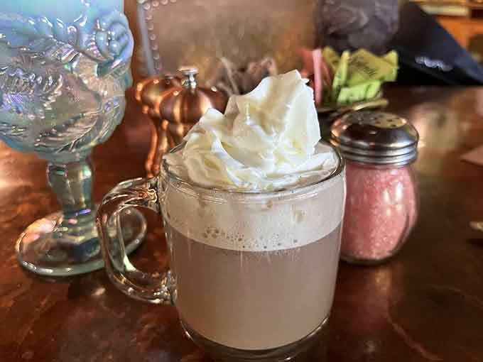 Topped with whipped cream and served in style, this hot cocoa is basically a hug in a mug.