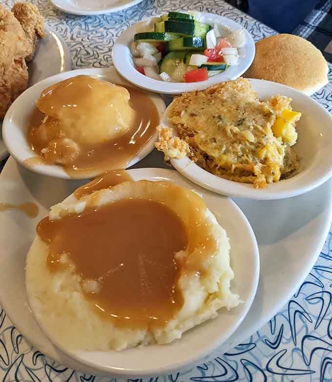 Mashed potatoes swimming in gravy with a side of squash casserole is comfort food speaking its native language fluently.