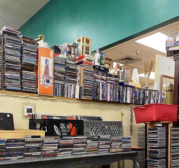 Media heaven for collectors! Those neatly stacked DVDs and CDs represent the brief technological window between VHS tapes and streaming services.