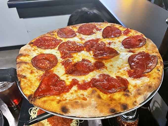 Classic pepperoni pizza with perfectly charred crust and bubbling cheese never goes out of style here.