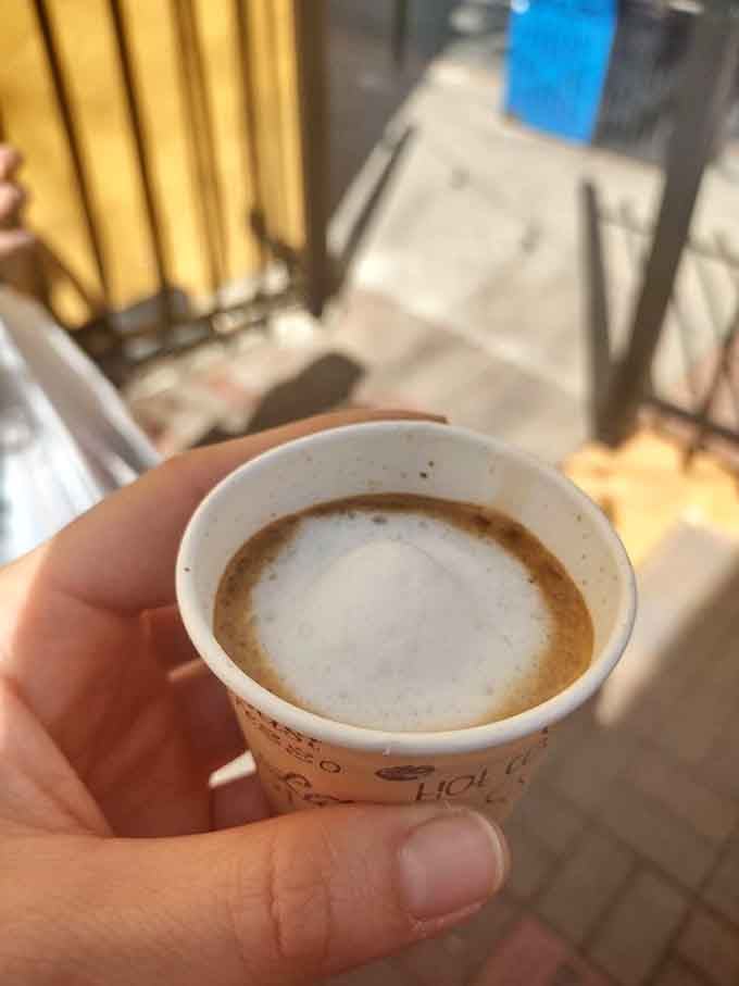 A perfectly crafted macchiato with latte art that's almost too pretty to drink, but you absolutely should anyway right now.