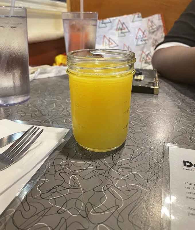 Fresh orange juice in a mason jar brings simple pleasures to your table, no fancy cocktails required here.