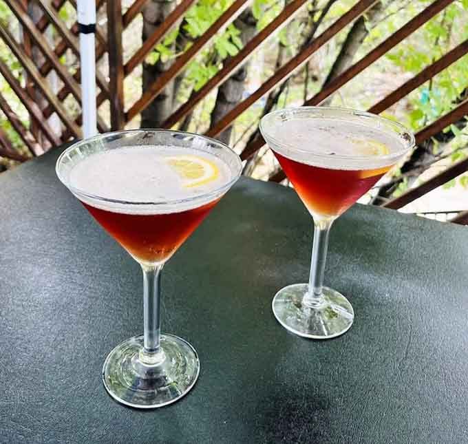 Two Hibiscus Cosmos catching afternoon light on the patio, because great meals deserve equally great cocktails alongside.