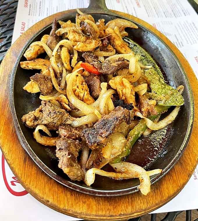 Sizzling fajitas that announce their arrival before you see them&mdash;a theatrical performance of meat, onions, and peppers that's worth the standing ovation.