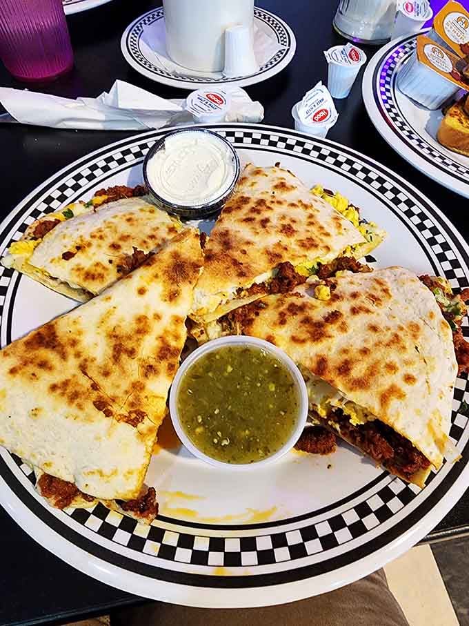 Golden quesadillas served with salsa verde prove that even retro diners know how to embrace delicious variety.