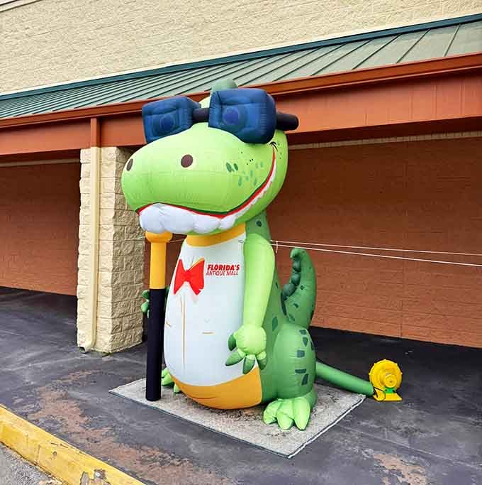 Florida's beloved gator mascot standing guard outside, because even antique malls need a cheerful reptilian security system.