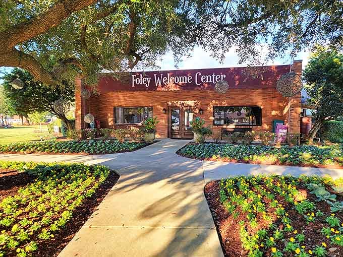 The Foley Welcome Center greets visitors with brick-and-mortar Southern hospitality, surrounded by manicured gardens that say "y'all stay awhile."