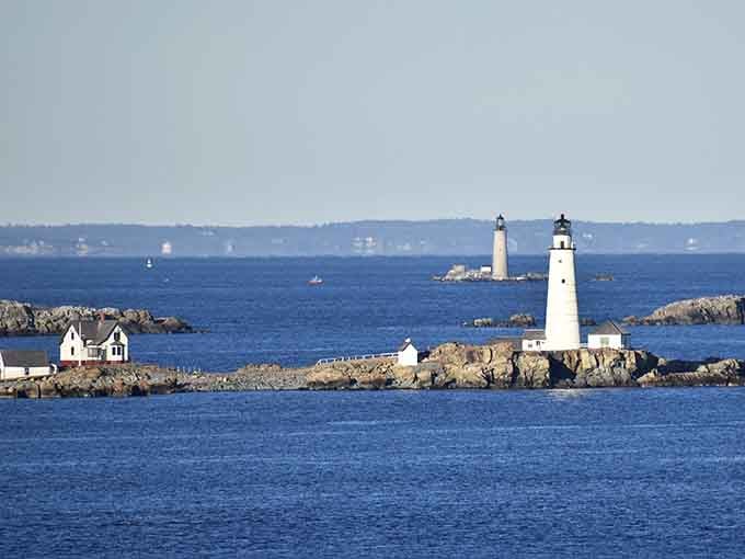 Boston Light stands sentinel in the distance, America's oldest lighthouse still doing its job after all these years of maritime duty.