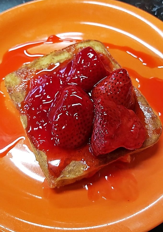 French toast crowned with strawberries and glaze, because sometimes breakfast deserves to feel like a celebration.