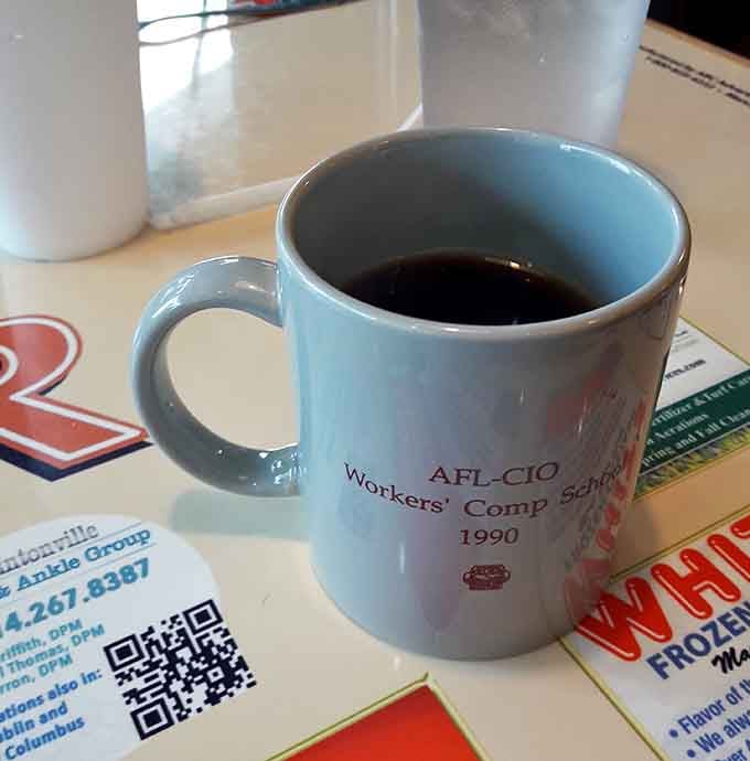 Hot coffee served in a classic mug tastes better when you're surrounded by good diner vibes.
