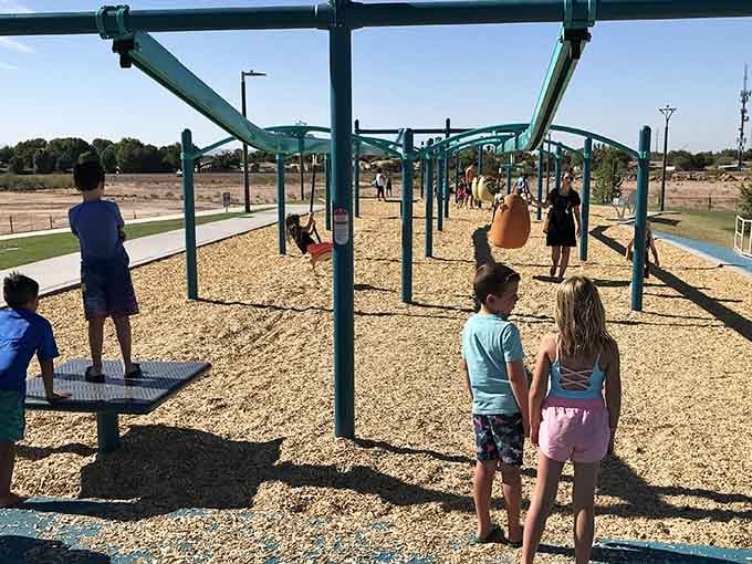Kids tackle this zipline structure like they're training for some extreme obstacle course competition on television.
