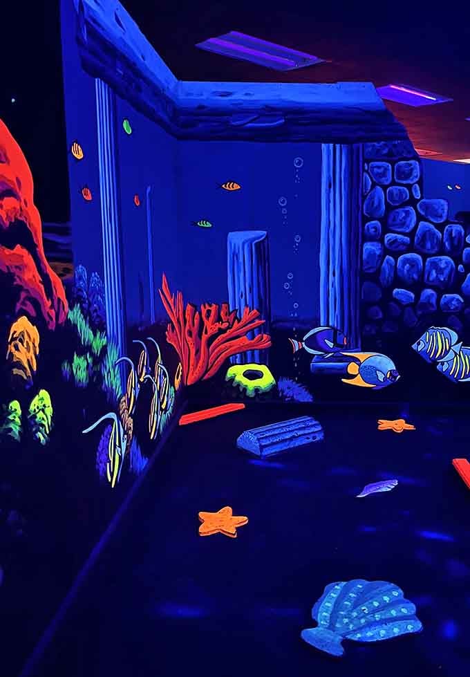 An underwater scene comes alive in electric blues, where tropical fish swim eternally in their fluorescent ocean paradise.
